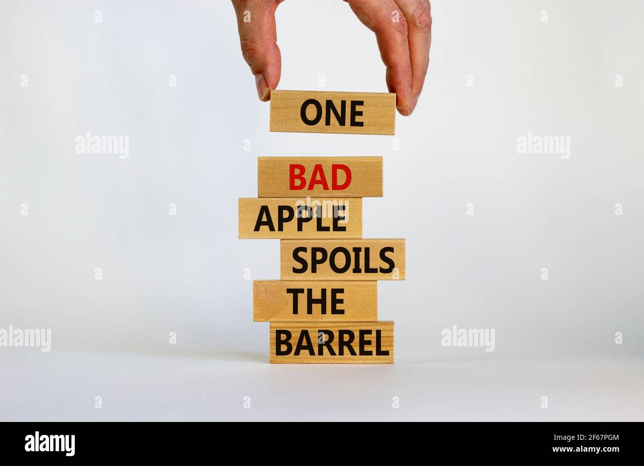 One bad apple spoils the barrel symbol. Wooden blocks with words 'One ...