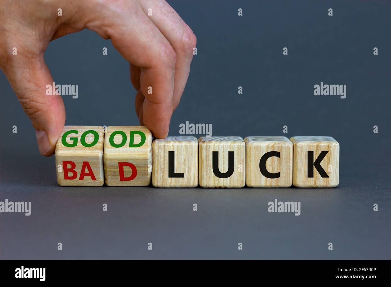 Good or bad luck symbol. Businessman turns wooden cubes and changes ...