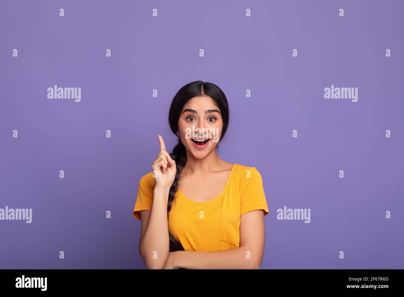 Excited indian woman has great idea and points up Stock Photo - Alamy
