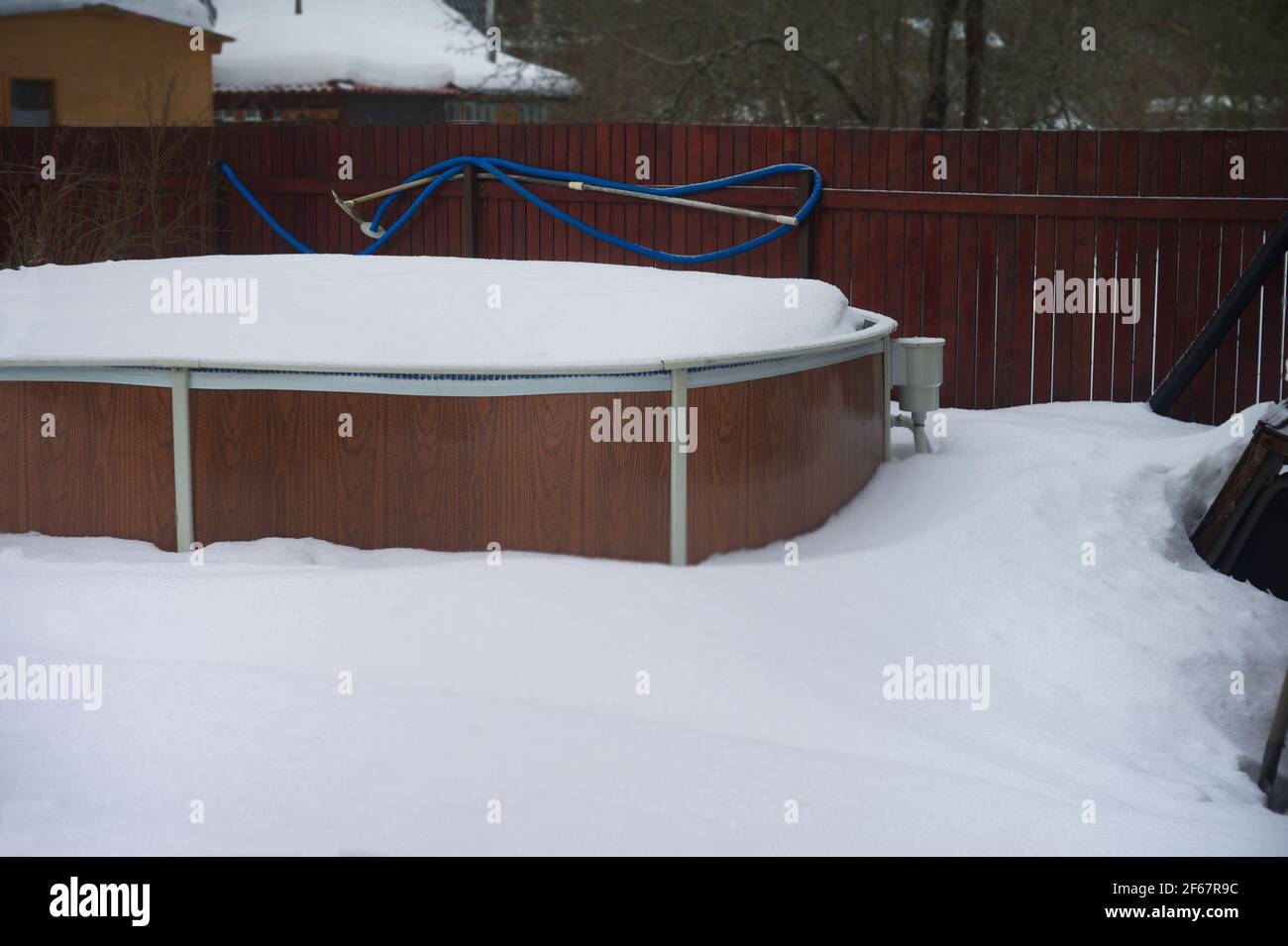 Above ground swimming pool completely under snow, winter scene Stock ...
