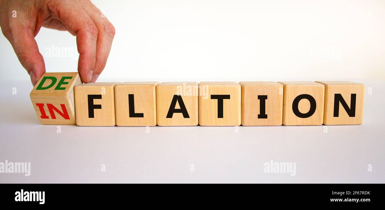 Inflation or deflation symbol. Businessman turns cubes and changes the ...