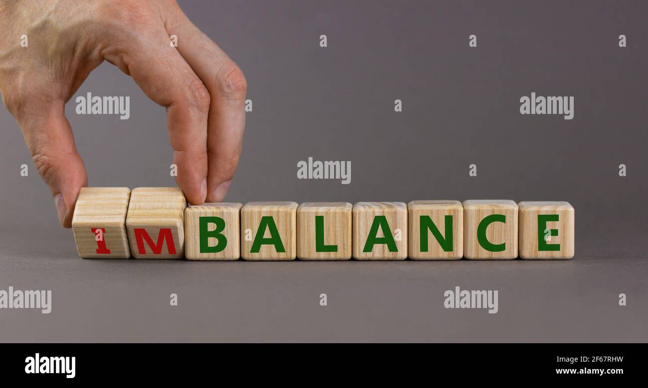 Balance or imbalance symbol. Businessman turns cubes and changes the ...
