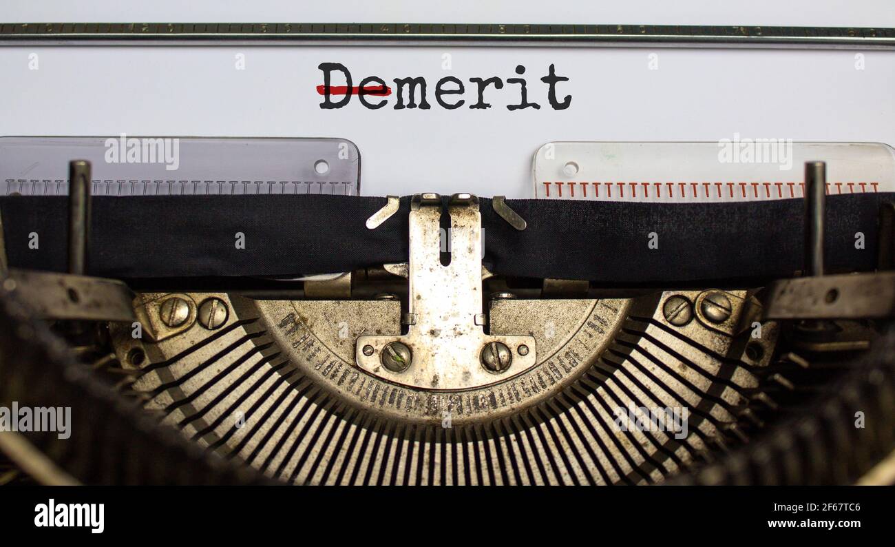 Demerit or merit symbol. The word 'demerit' changed to 'merit' typed on ...
