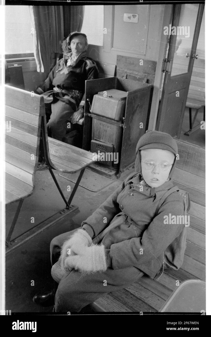 Train travelers in 3rd grade cart Stock Photo - Alamy