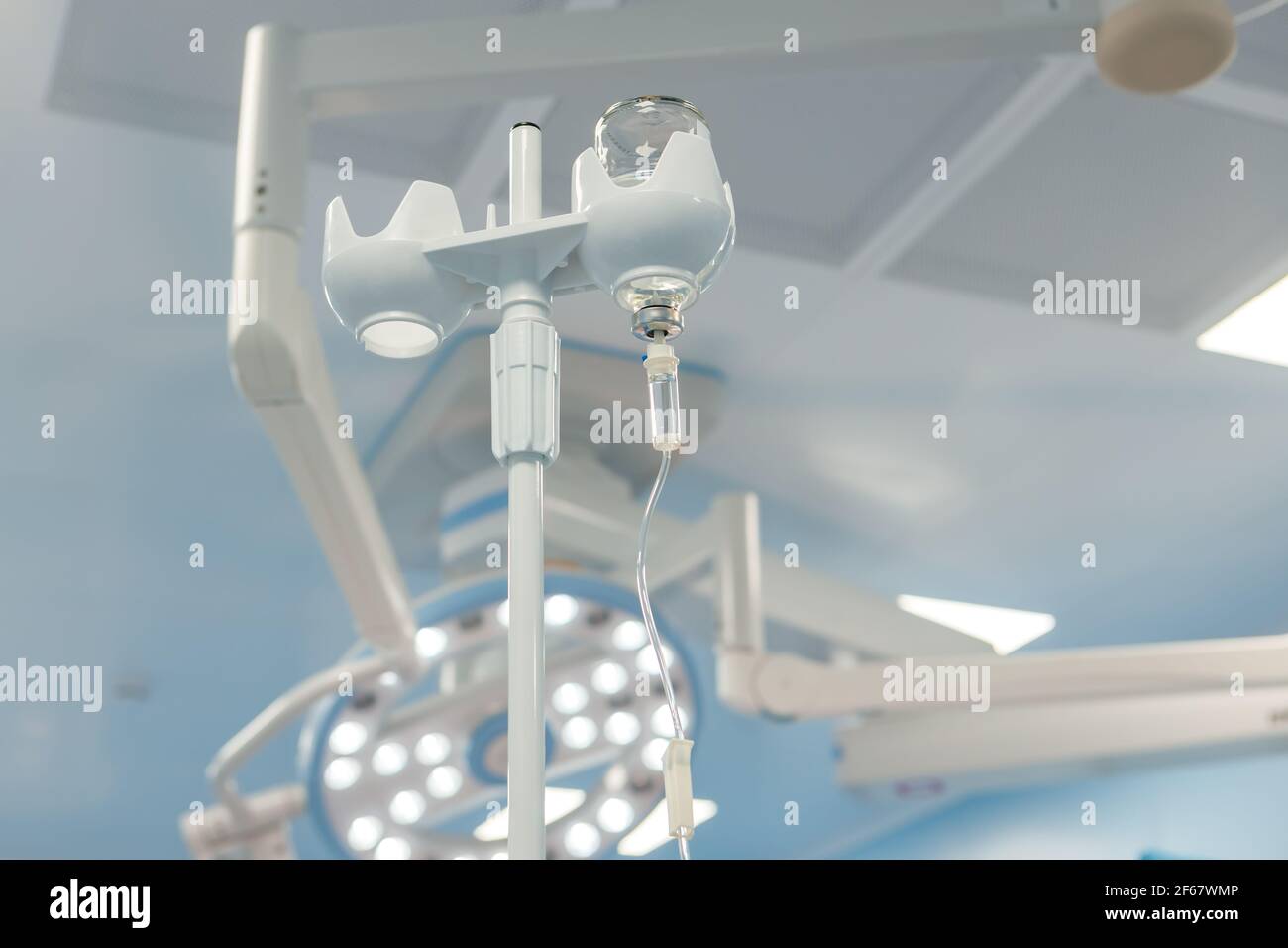 A dropper with medication in the operating room against the background ...