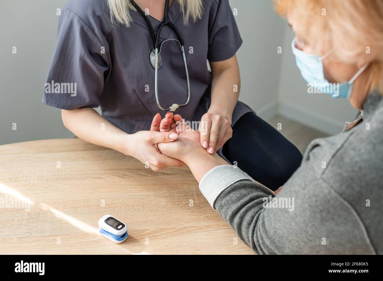 Taking pulse of a sick man hi-res stock photography and images - Alamy