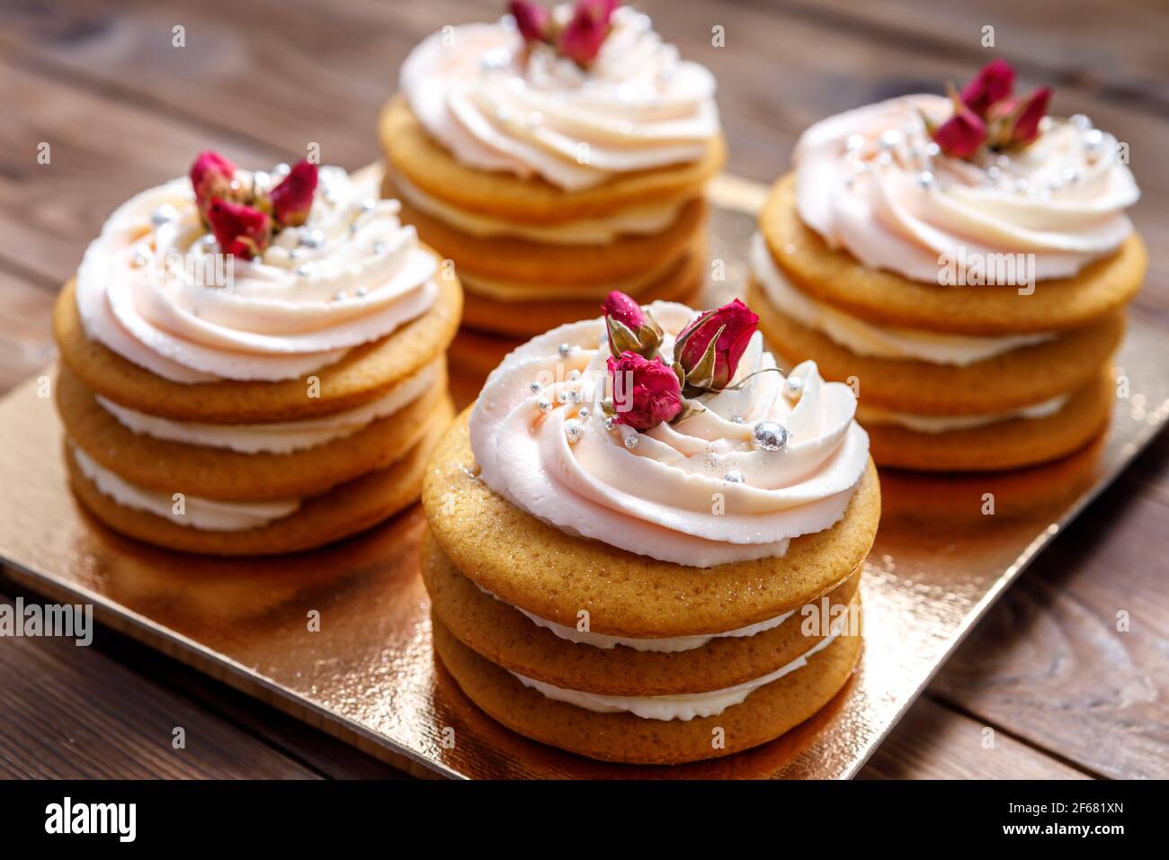 Sponge cake with cream, decorated with small flowers. The concept of a ...