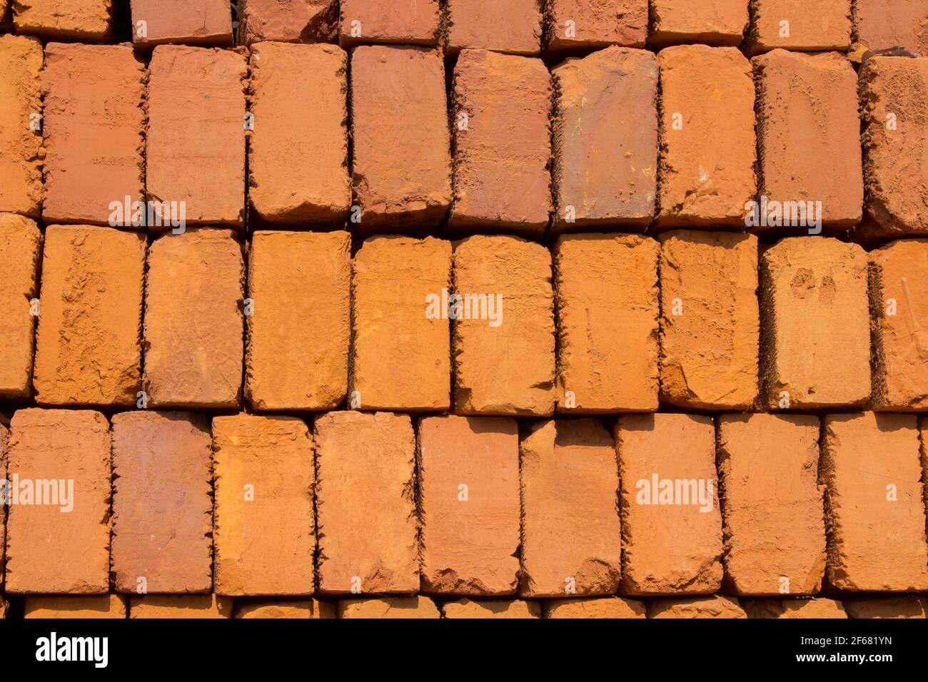 Pile of red Bricks by compiled a background Stock Photo - Alamy