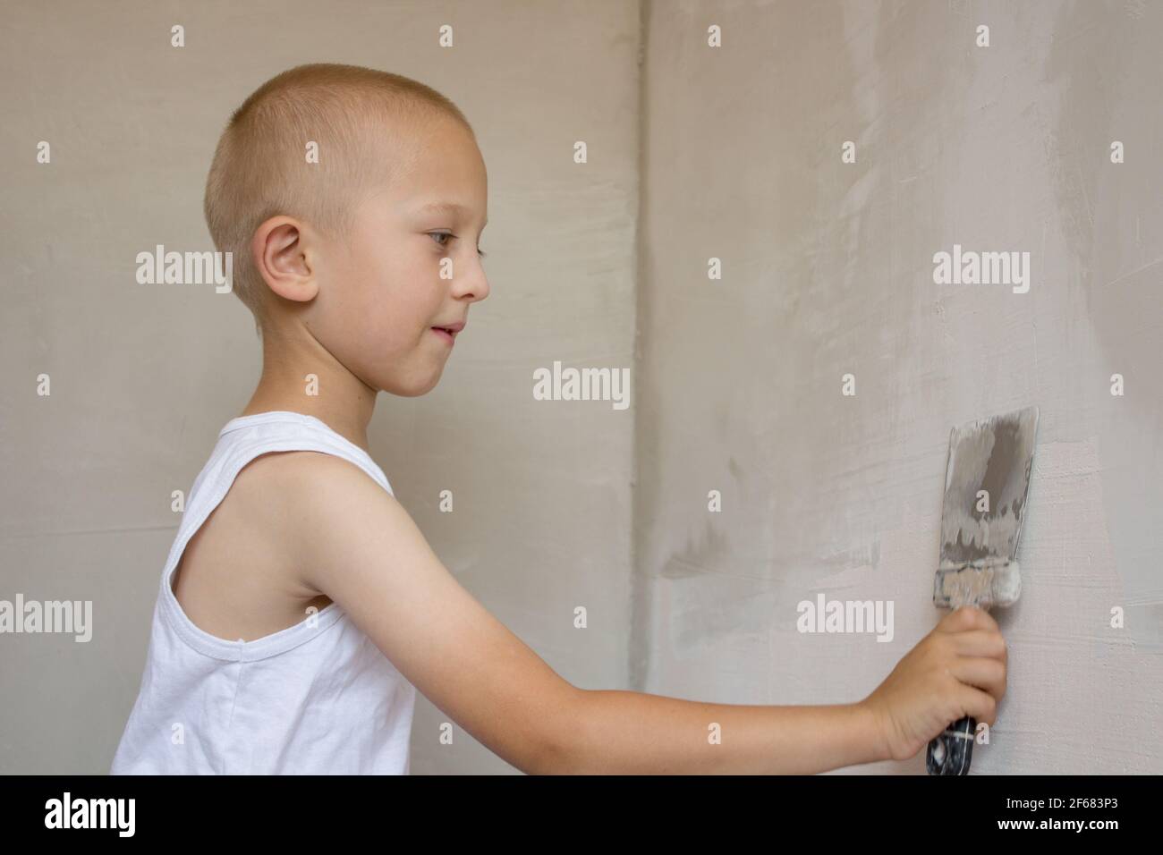 Worker spreading plaster to wall with trowel, repairing works Stock ...