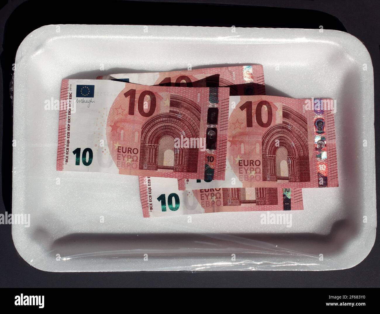 euros money inside a meat package, concept of price of meat industry ...