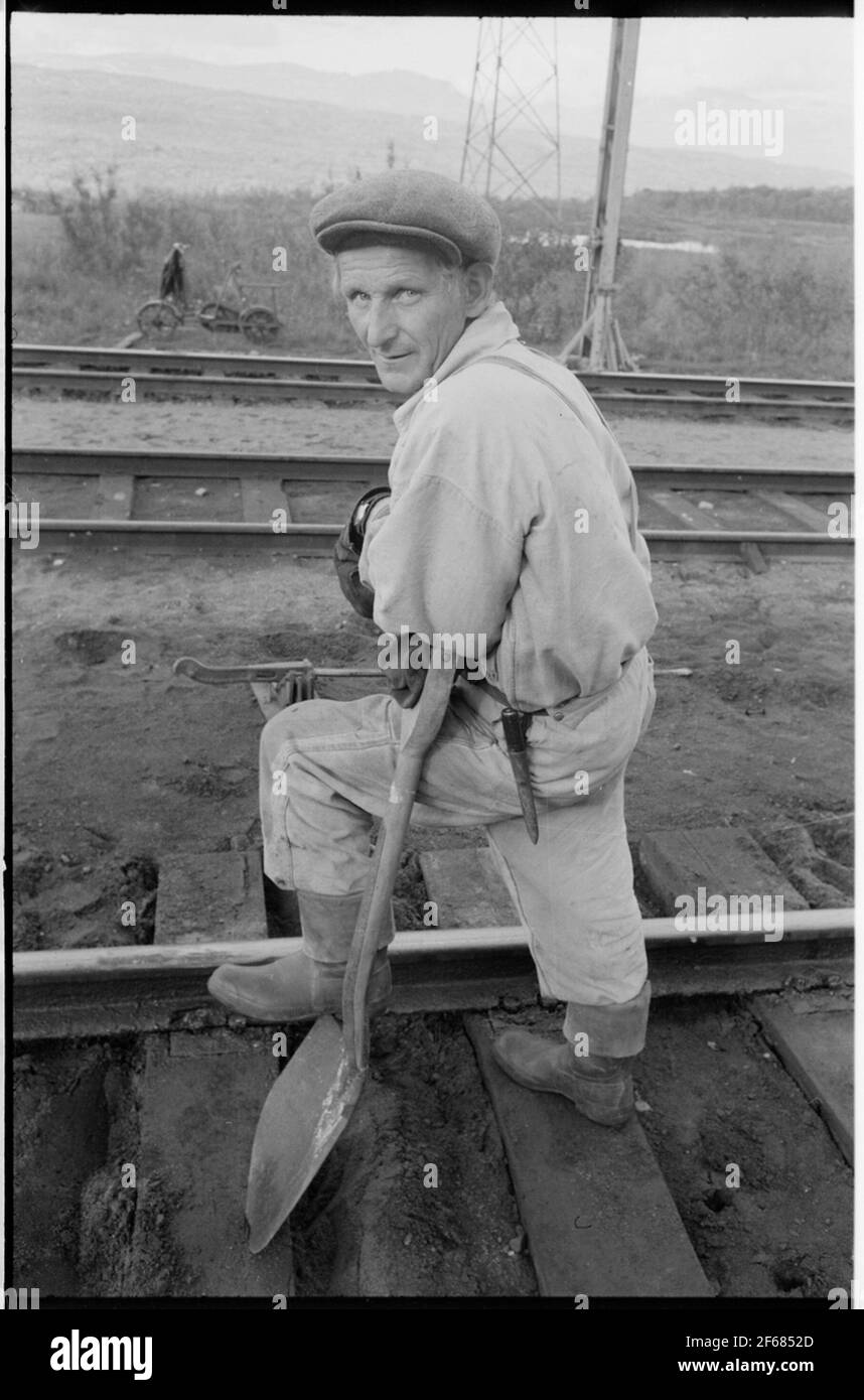 Track workers with spade Stock Photo - Alamy