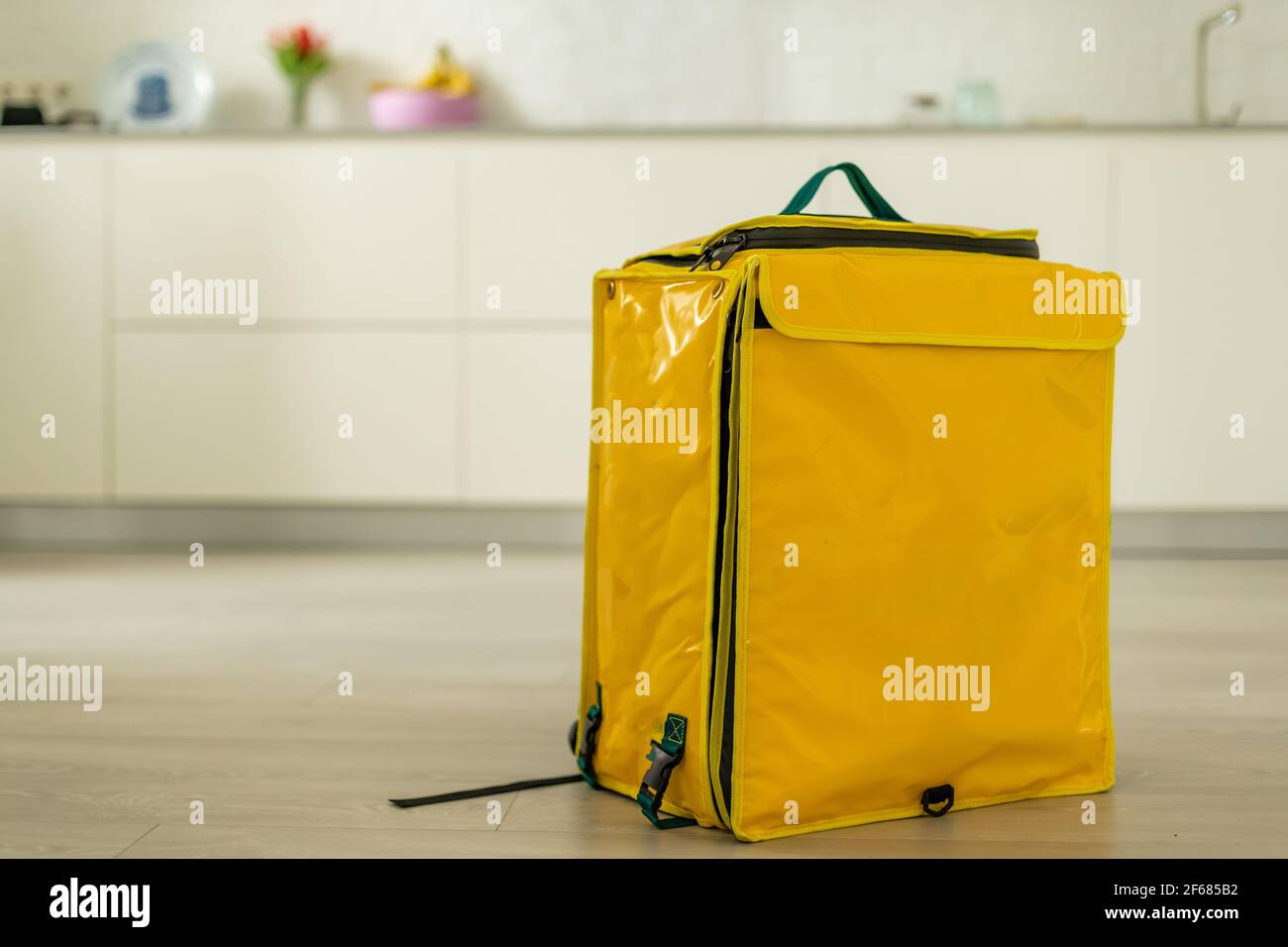 Closeup of delivery backpack, yellow food delivery bag Stock Photo - Alamy