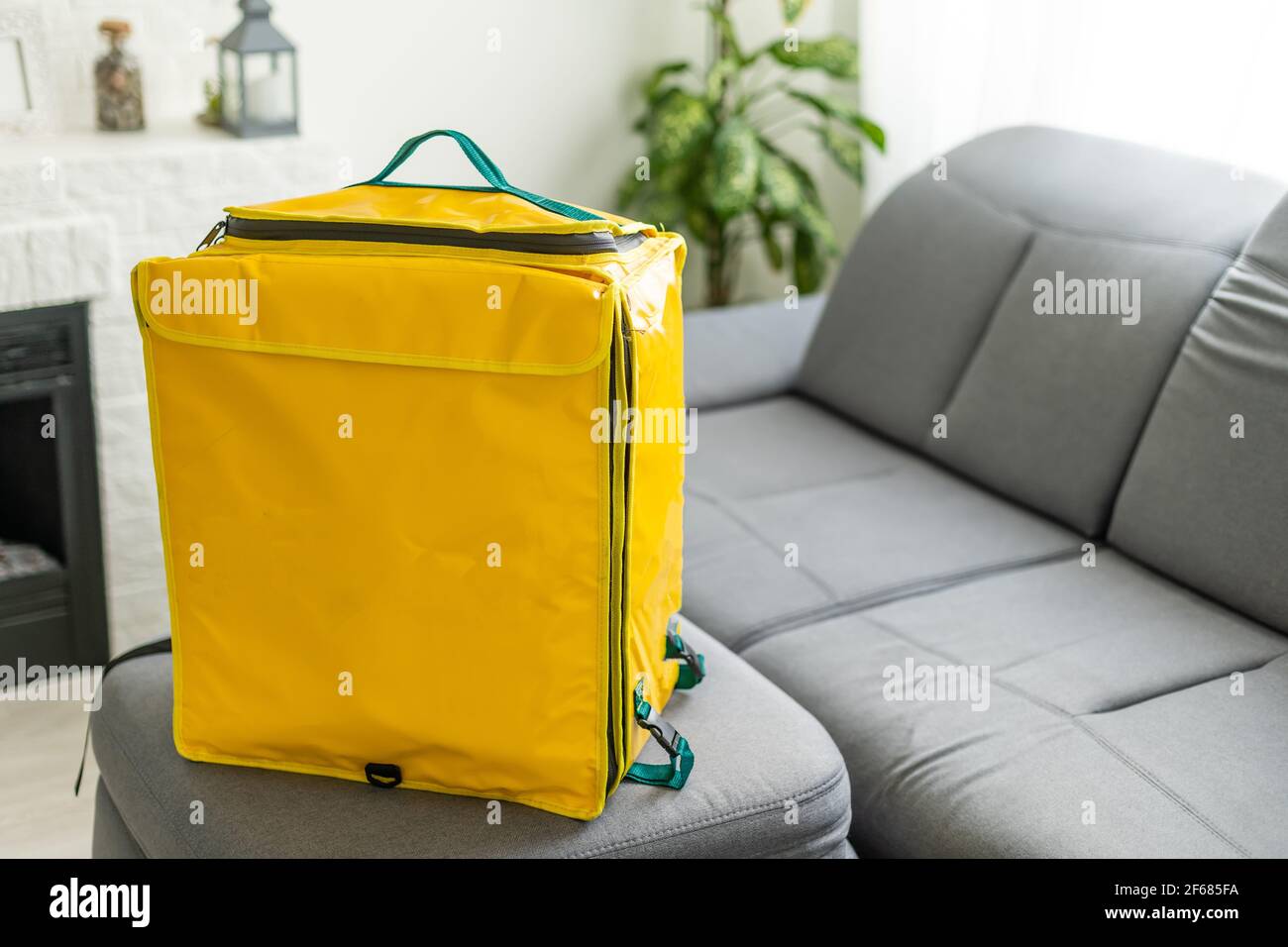 Closeup of delivery backpack, yellow food delivery bag Stock Photo - Alamy