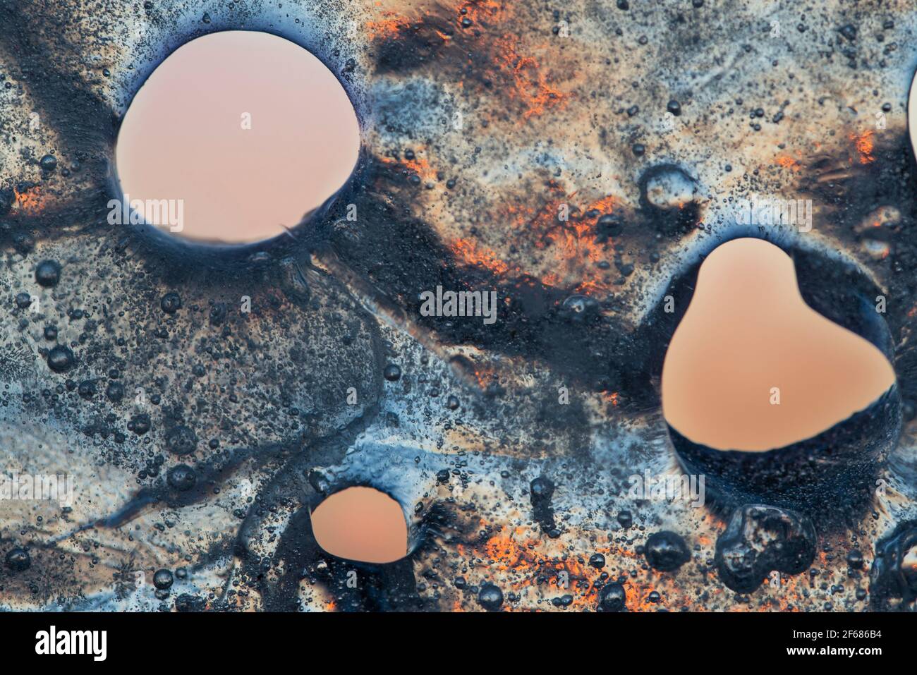 Frozen bubbles in the ice close-up. Selective focus. Abstract ...