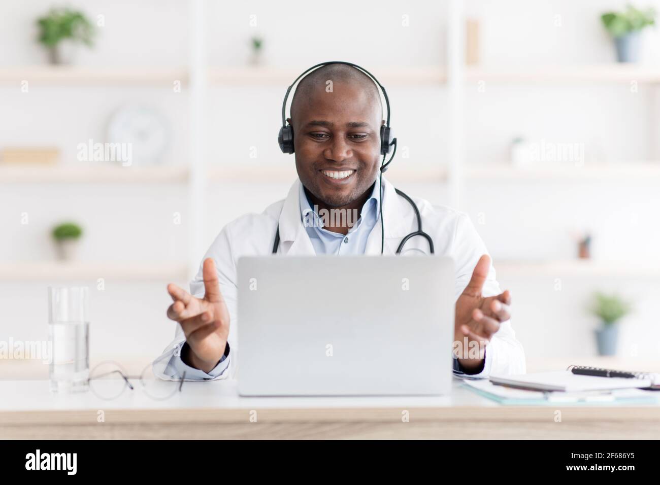 Highly qualified african american doctor consultating patients ...