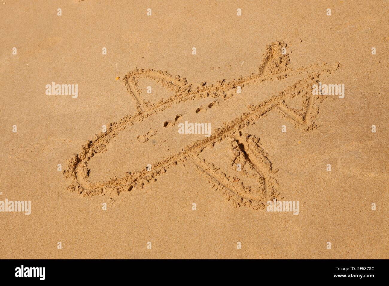 Sign on the beach - a plane Stock Photo - Alamy