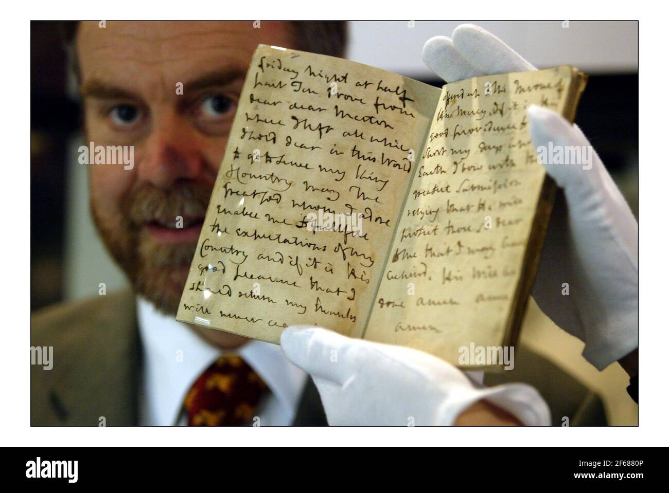 Prof Andrew Lambert with a codicil belonging to Nelson, part of the ...