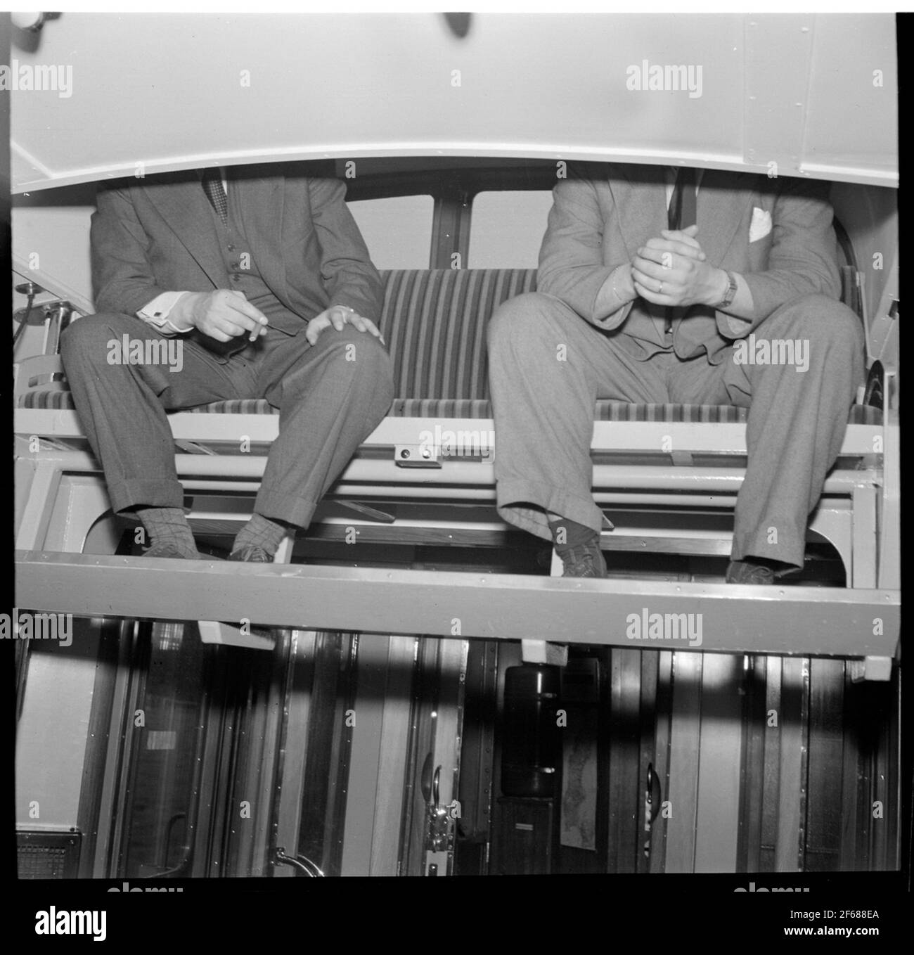 Two men in a measuring cart Stock Photo - Alamy