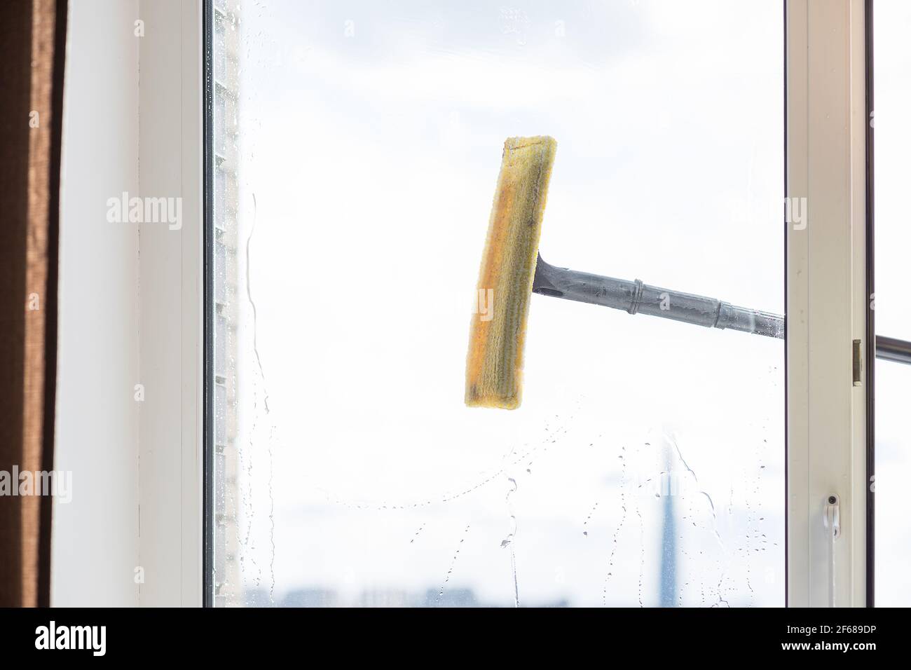 people, housework and housekeeping concept -close up of woman cleaning ...