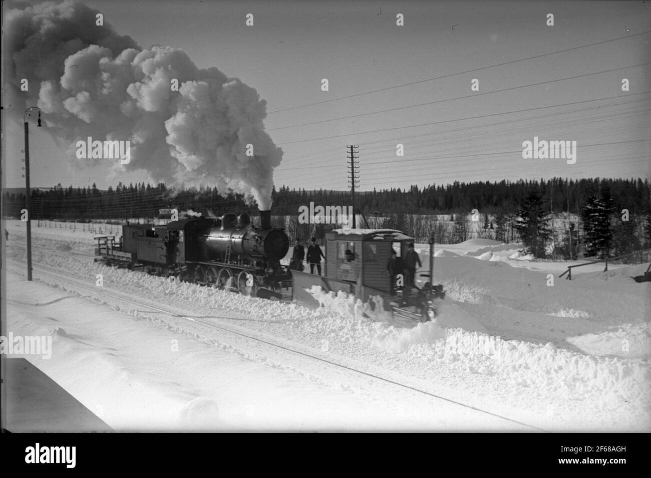 Wing plow in work on the railroad Stock Photo - Alamy