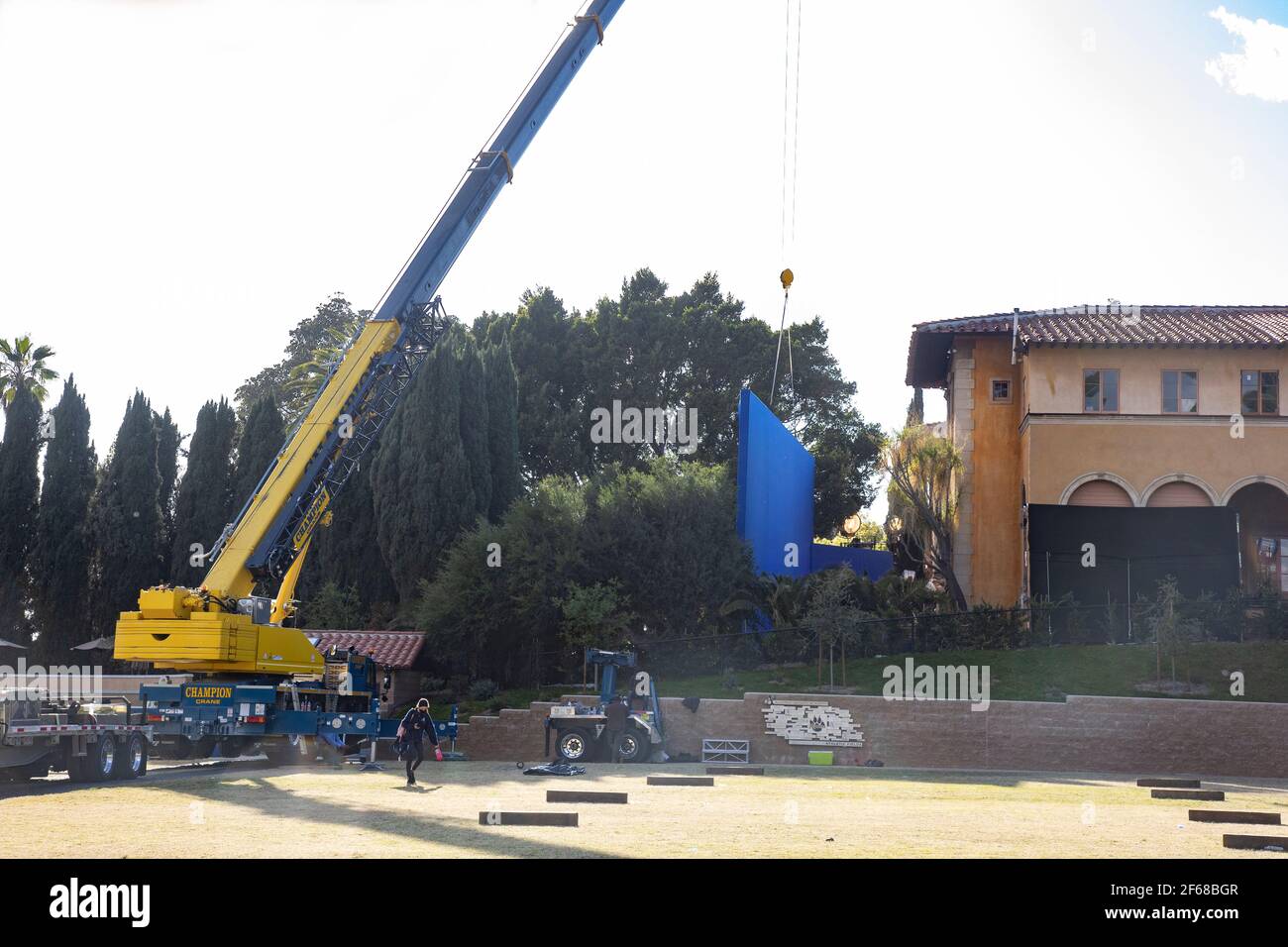 Crane Lifting a Large Blue Screen Stock Photo - Alamy