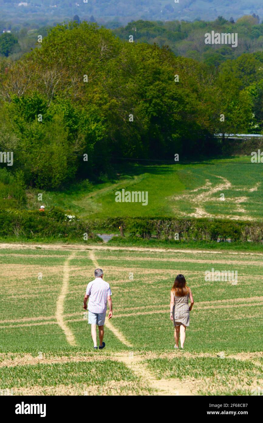 Man walking footpath by spring field hi-res stock photography and ...