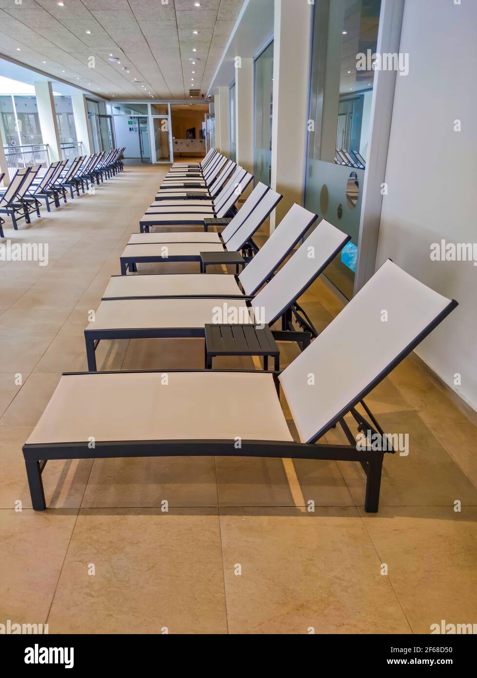 Beds in the line in the wellness center Stock Photo - Alamy