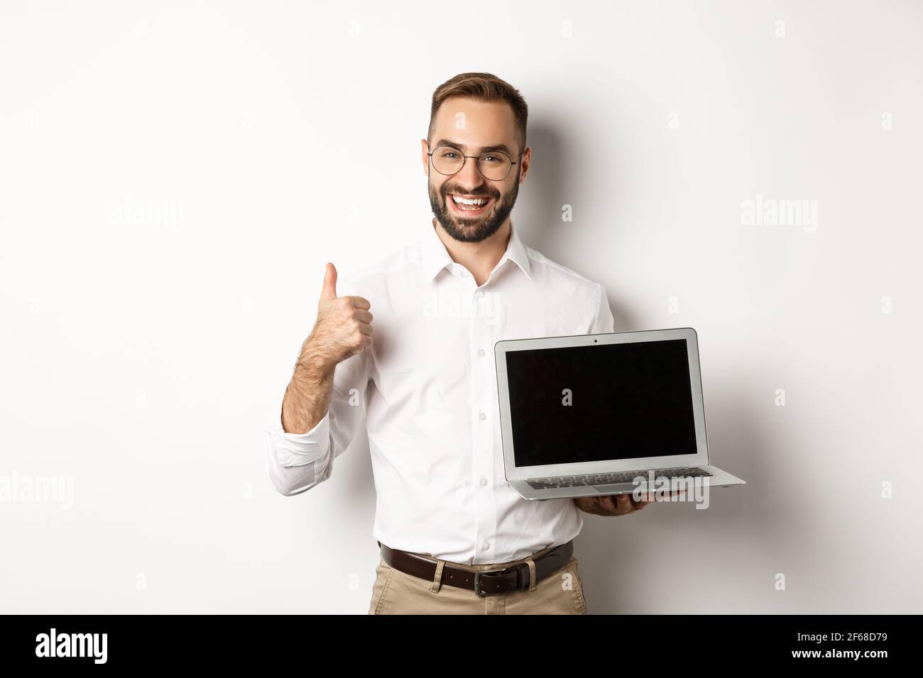 Successful business man showing laptop screen, make thumb up in ...