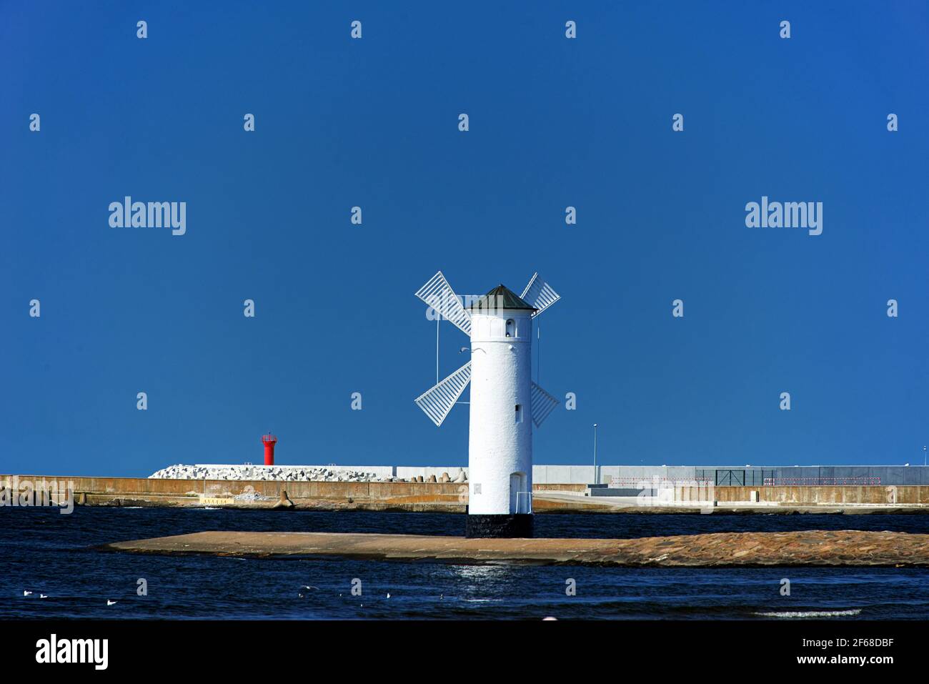 Windmill lighthouse on the pier in Swinoujscie Poland Stock Photo - Alamy
