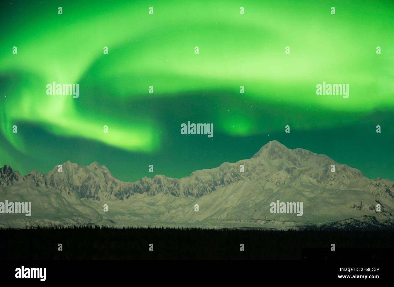 Alaska Range Mountains, lit up with the Aurora Borealis or Northern ...
