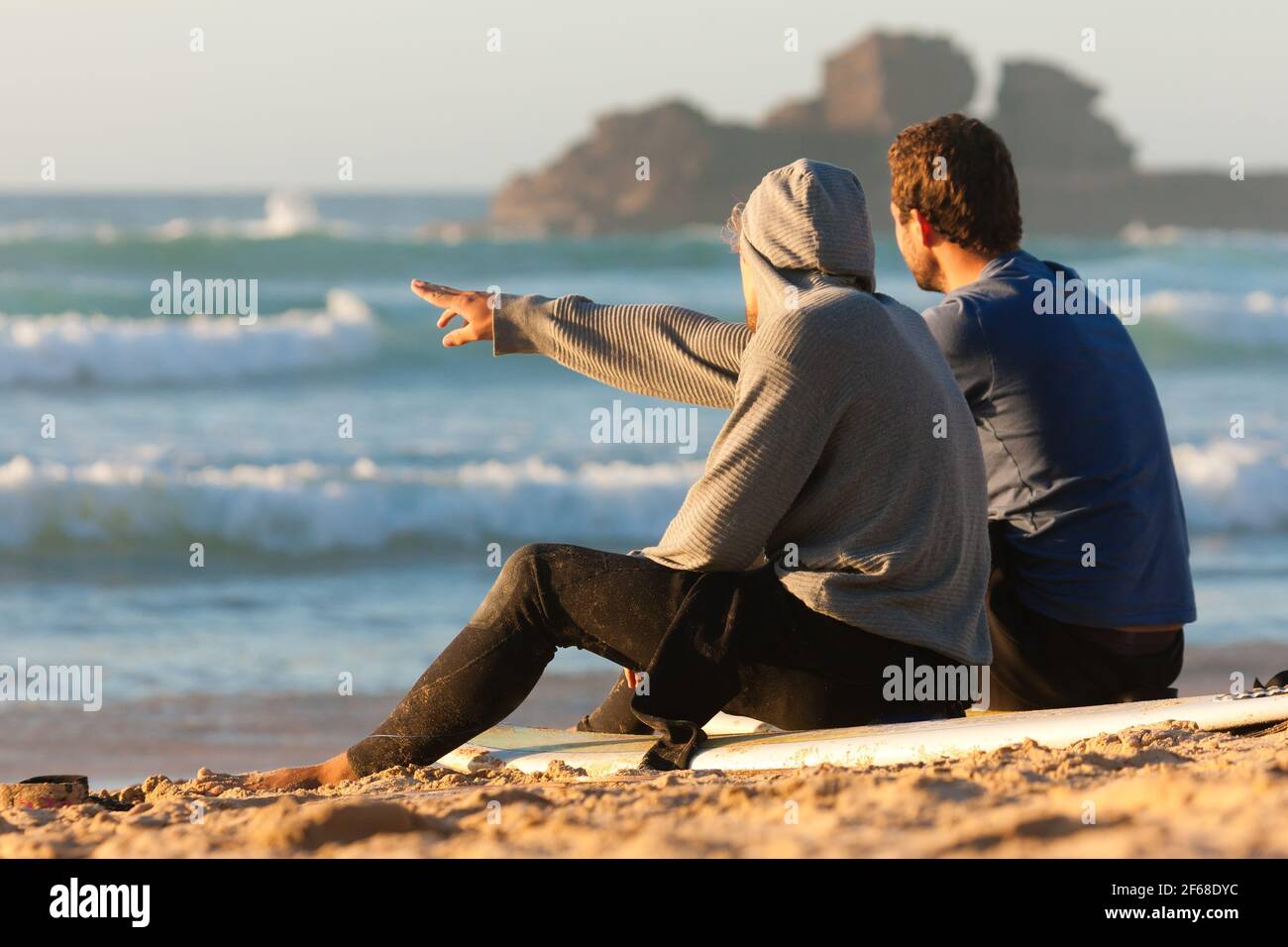 Surfers sitting on boards hi-res stock photography and images - Alamy