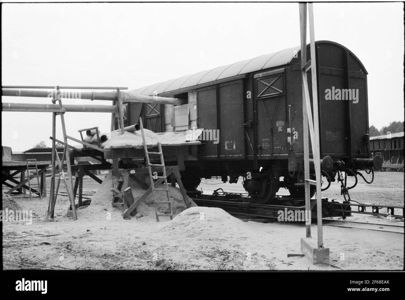 Loading freight trolley at Myresjöhus Industrial track. The freight ...