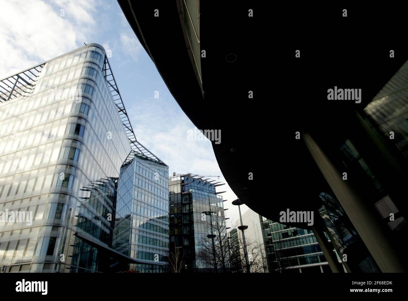 Modern glass buildings in and around the Tower Bridge area, London ...