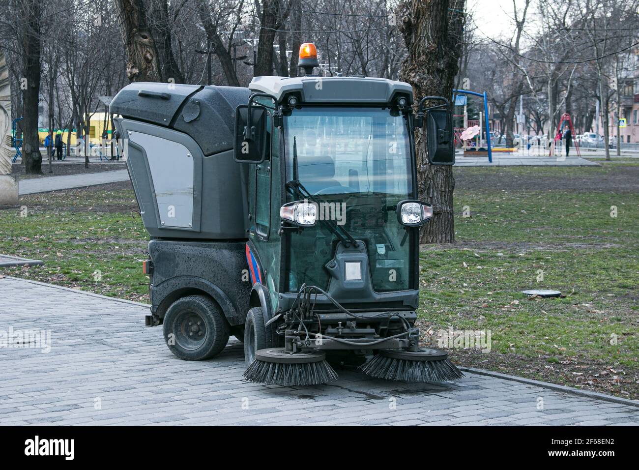 Close-up sweeper machine cleaning. Concept clean streets from debris ...