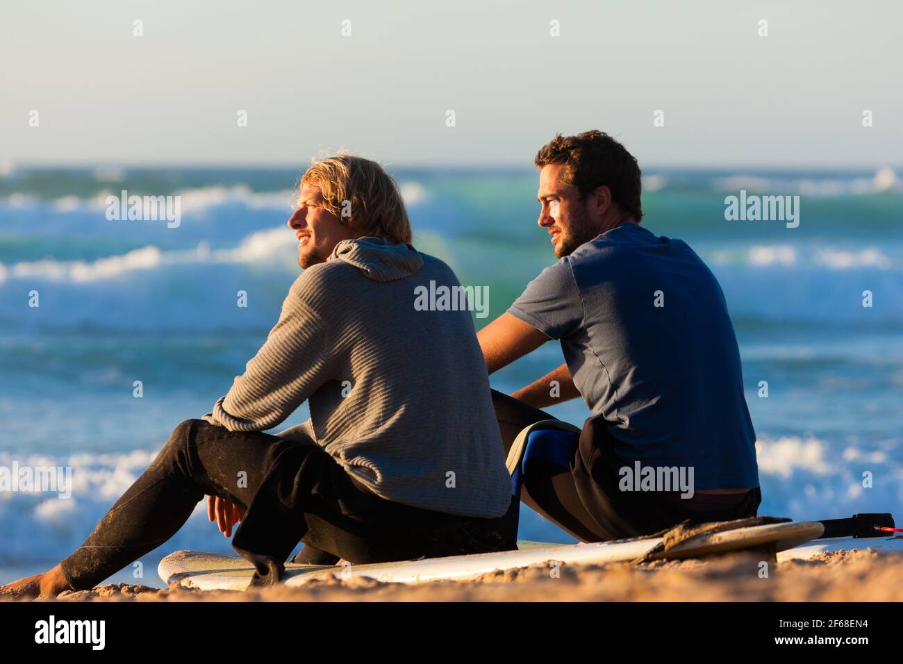Surfers sitting on boards hi-res stock photography and images - Alamy