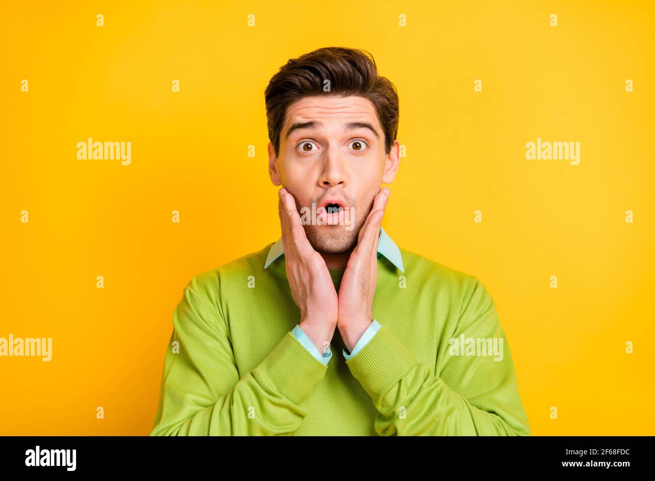 Portrait Of Young Handsome Shocked Surprised Amazed Man Hold Hands
