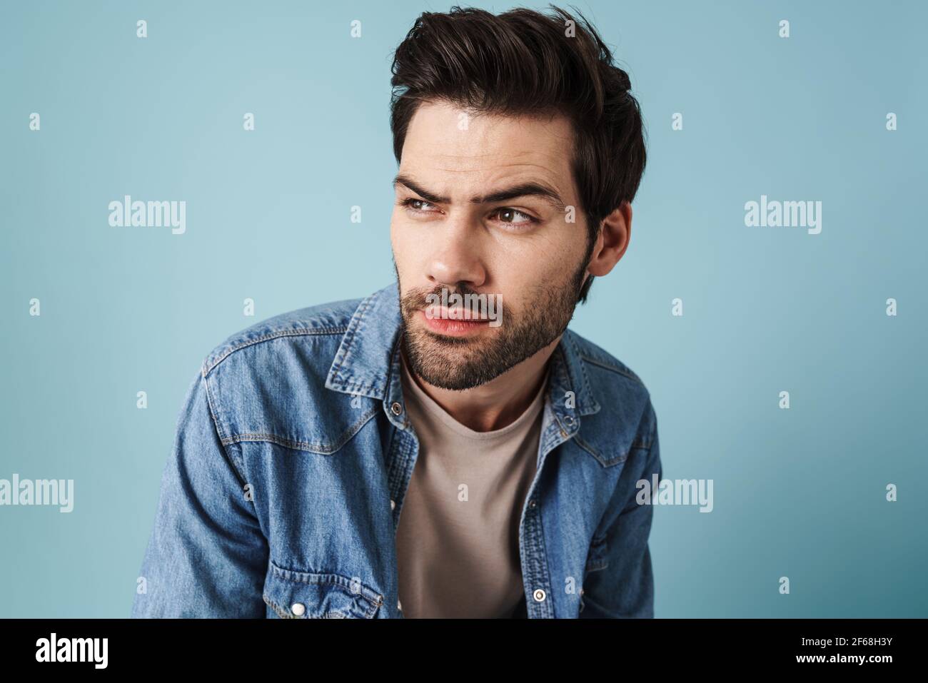 Brooding young unshaven man hi-res stock photography and images - Alamy