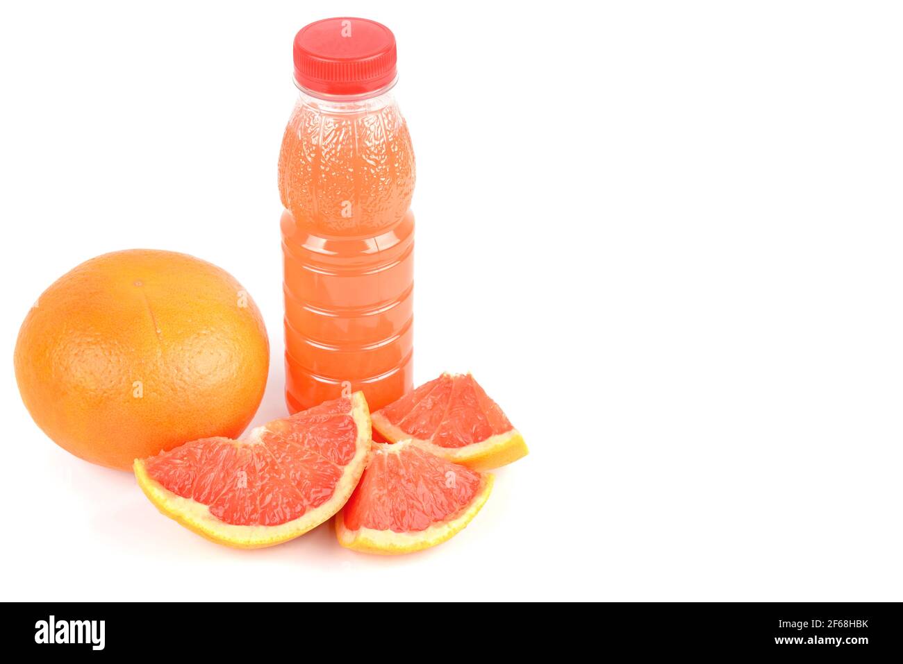 A fruit of grapefruit and a bottle with juice isolated on white ...