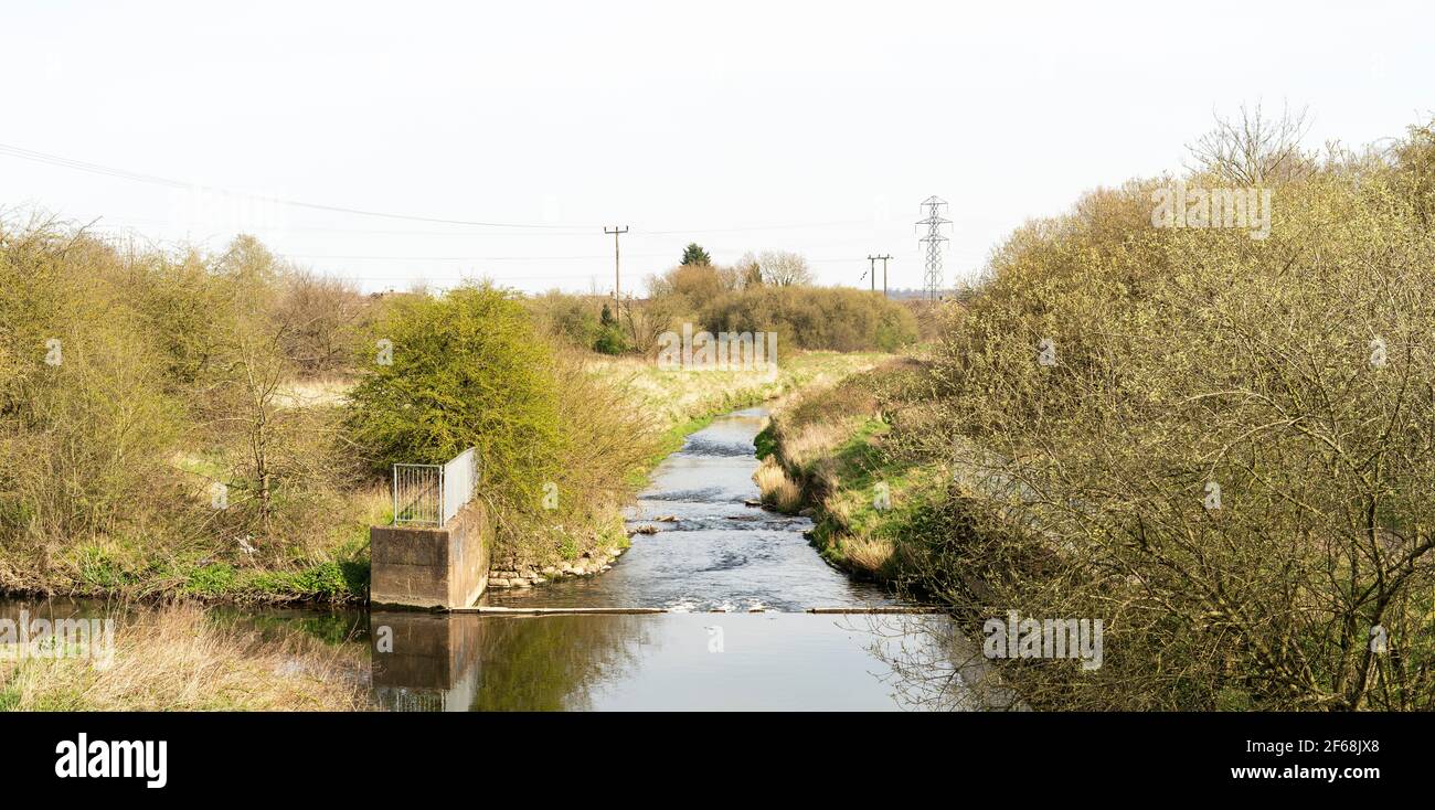 Narrow river with stepped weirs Stock Photo - Alamy