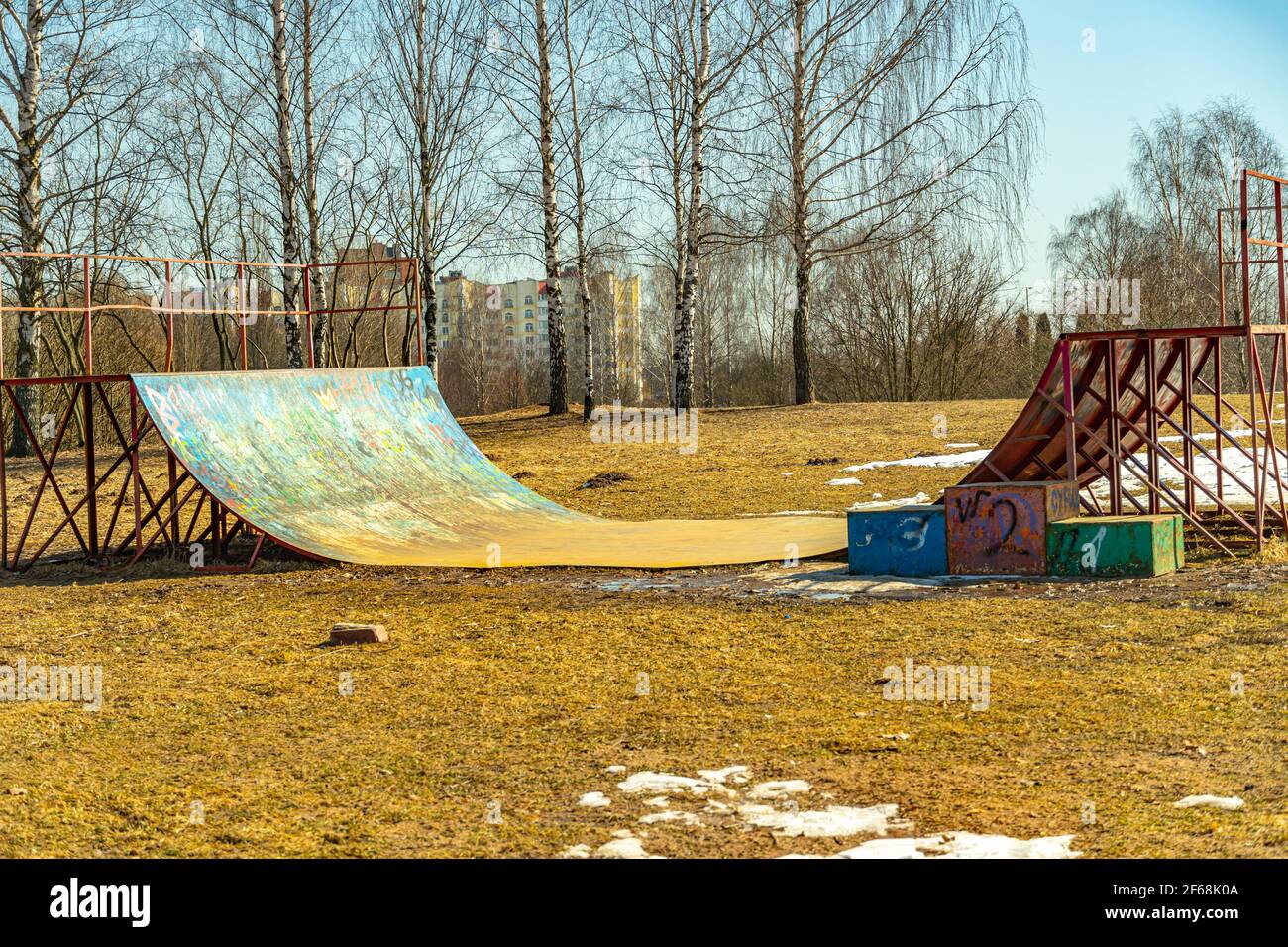 An abandoned painted rusty skate and roller ramp on the outskirts of ...