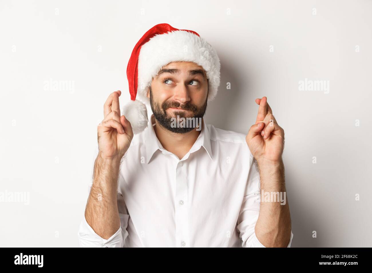 Party, winter holidays and celebration concept. Happy man in santa hat ...