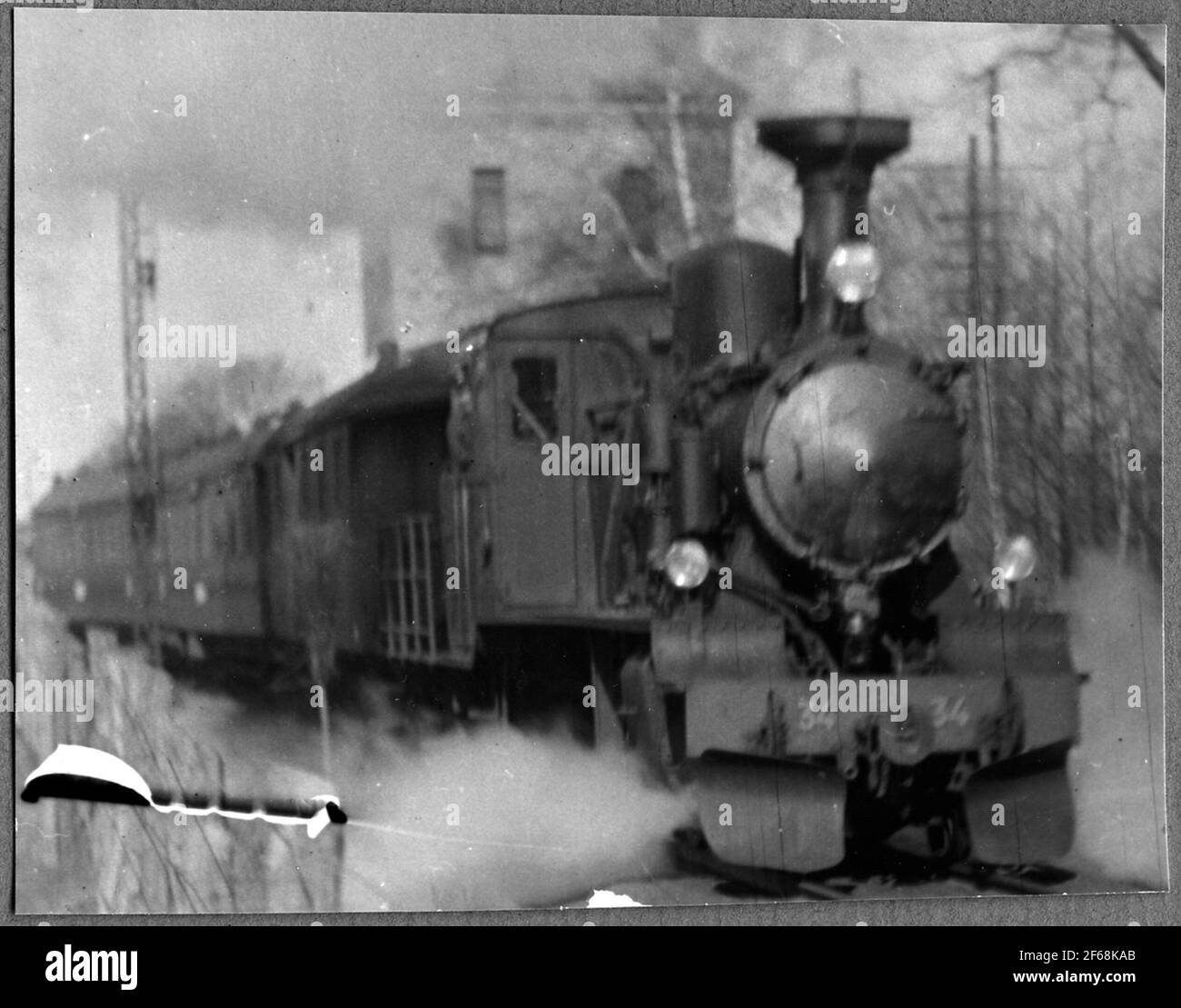 NVHJ Lok 34 with passenger train at the exit from Jenny Station Stock ...