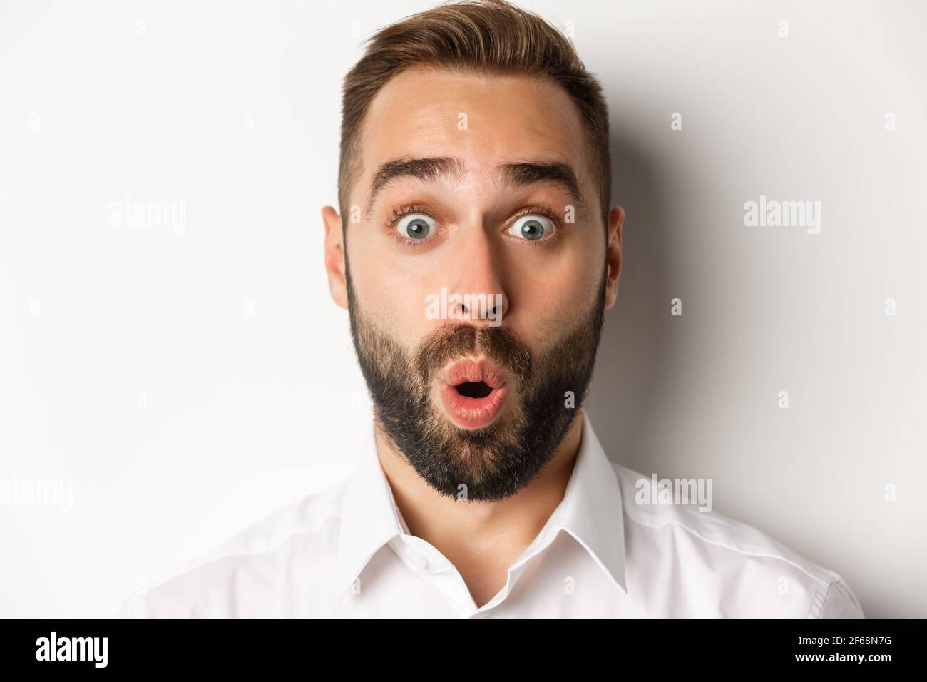 Emotions and people concept. Headshot of man express surprised and ...