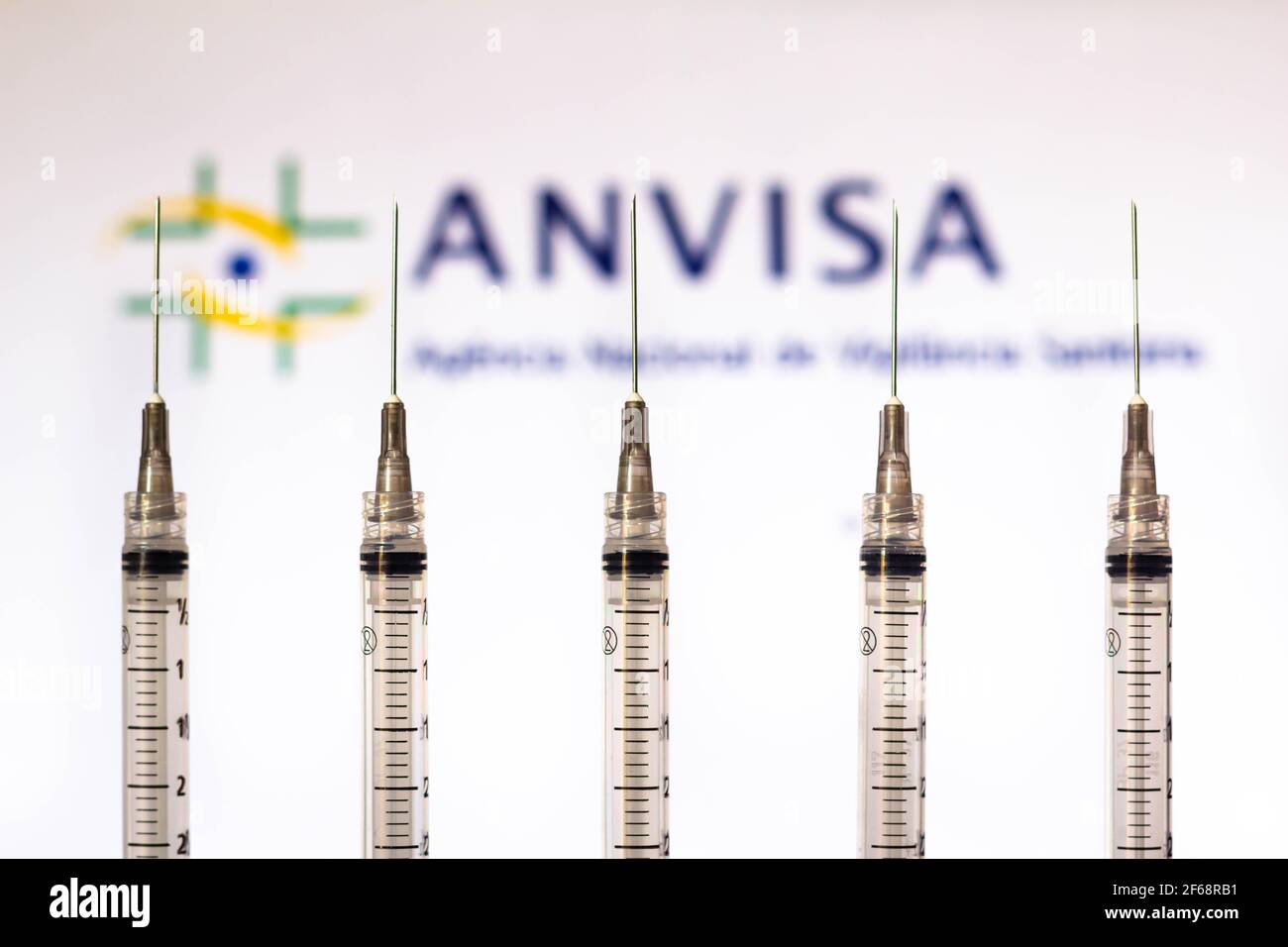 In this photo illustration, medical syringes seen with the National ...