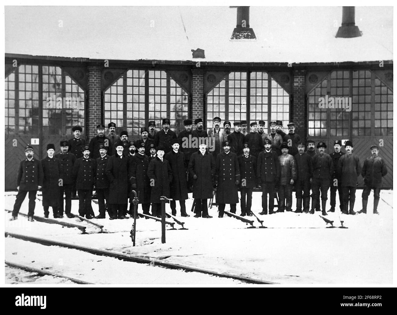 The machine department's staff outside the booth locomotive Stock Photo ...