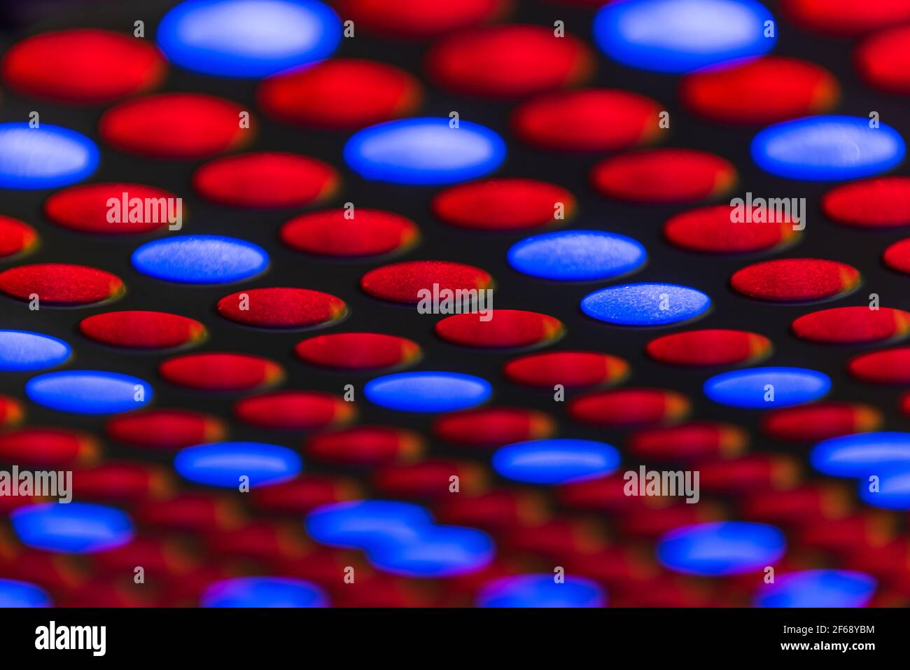 An abstract background made of red and blue led with white dots and ...
