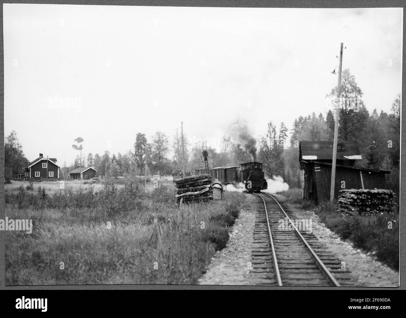 Steam locomotive with freight trains and passengers in the open freight ...
