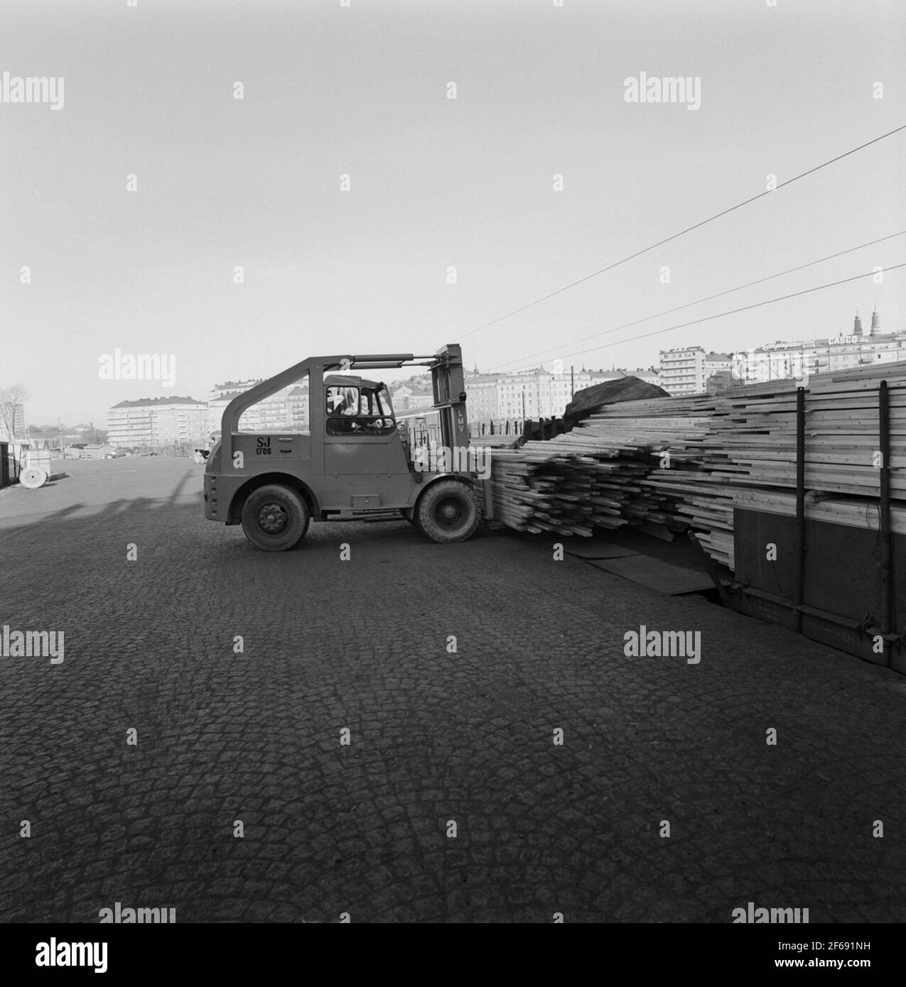Wood and cable load with Truckliljeholmens rail yard Stock Photo - Alamy