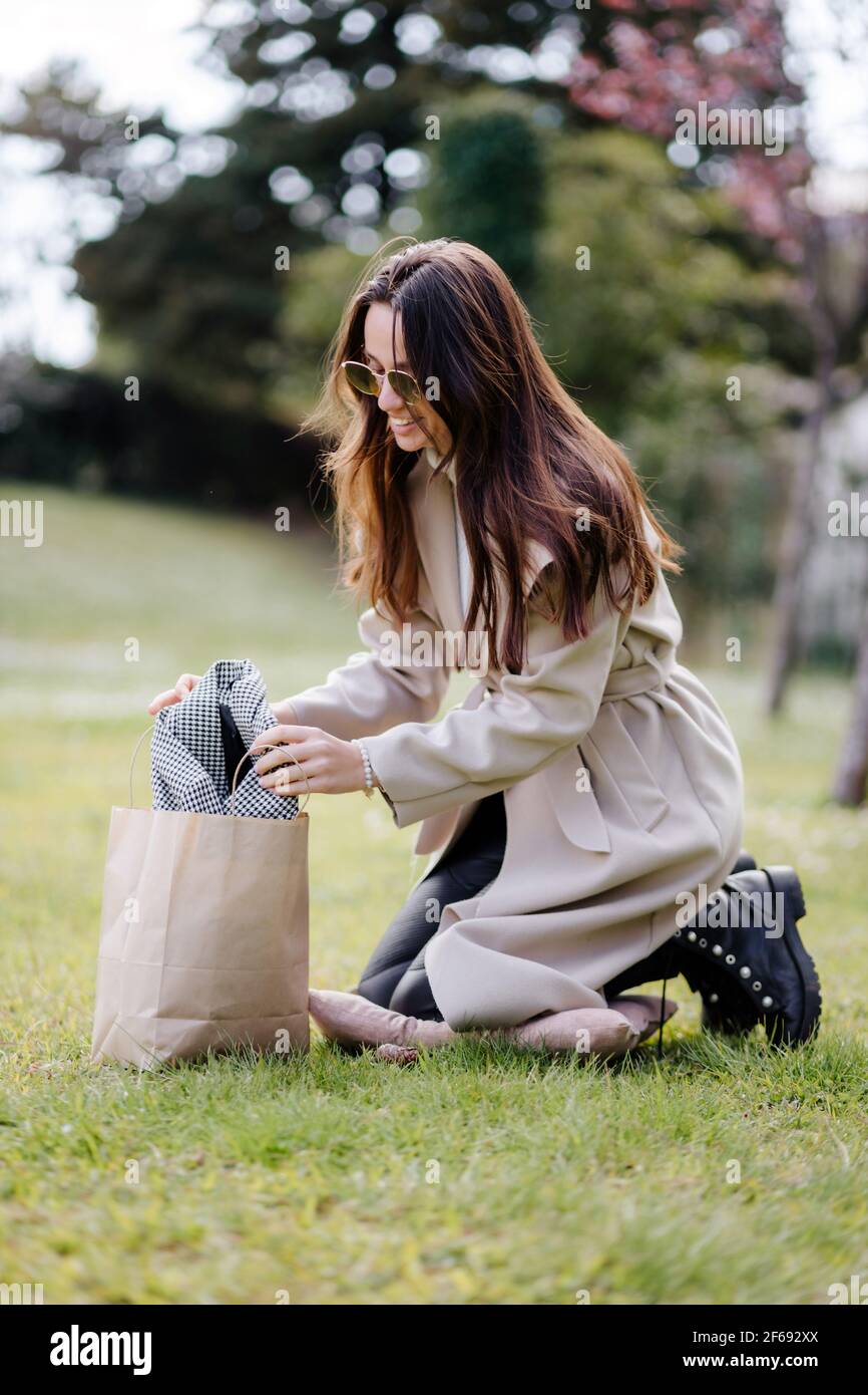 Female customer getting paper bag hi-res stock photography and images ...