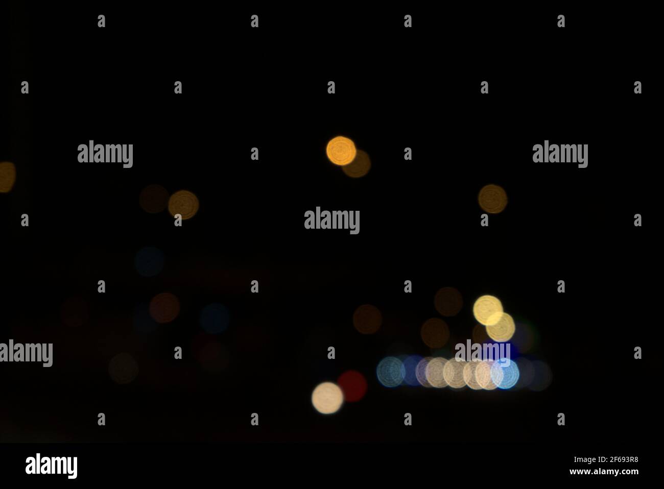 Colored circular blurry bokeh combination of transportation, cars and ...